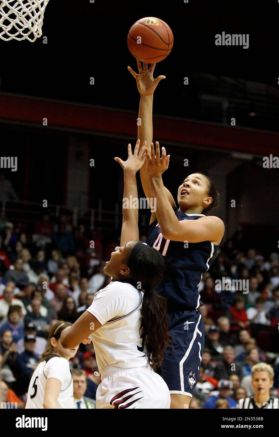 Connecticut center Kiah Stokes (41) puts up a shot over Cincinnati ...
