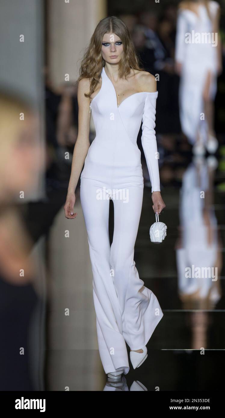 A model presents a creation by Italian fashion designer Donatella ...