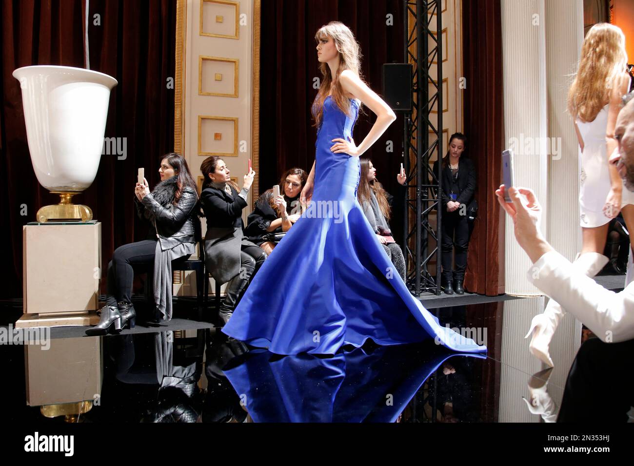 A model presents a creation by Italian fashion designer Donatella ...