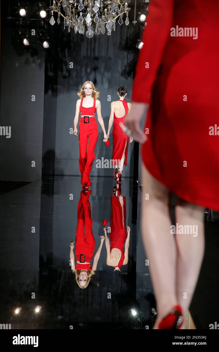 Models present creations by Italian fashion designer Donatella Versace ...