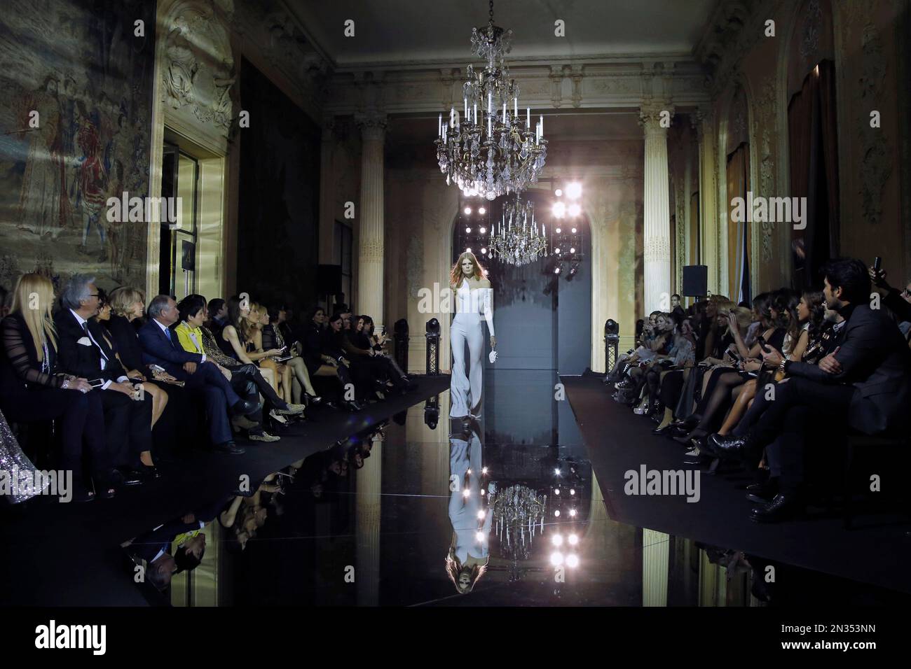 A model presents a creation by Italian fashion designer Donatella ...