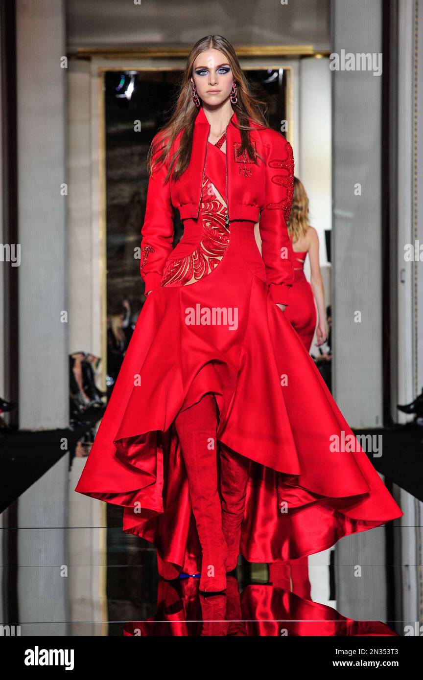 A model presents a creation by Italian fashion designer Donatella ...