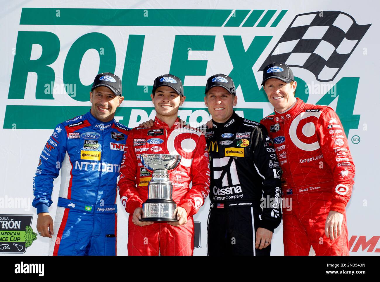 Winning drivers of the IMSA 24 hour auto race, from left, Tony Kanaan ...
