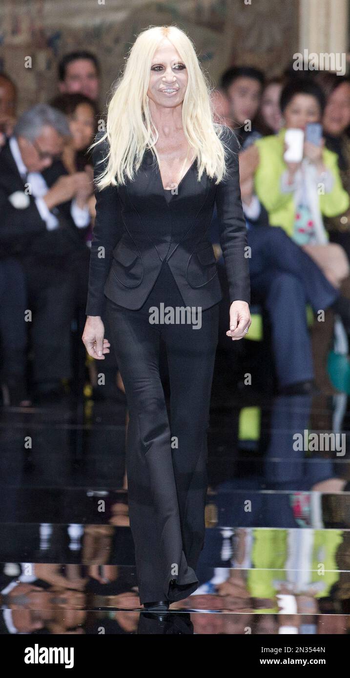 Italian fashion designer Donatella Versace acknowledges applause ...