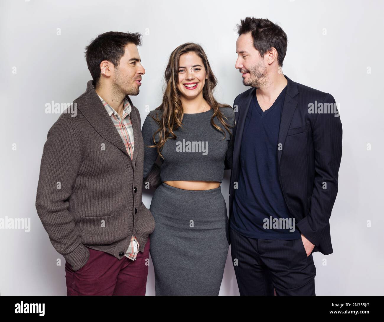 Director Eli Roth, from left, Lorenza Izzo and Keanu Reeves pose for a ...