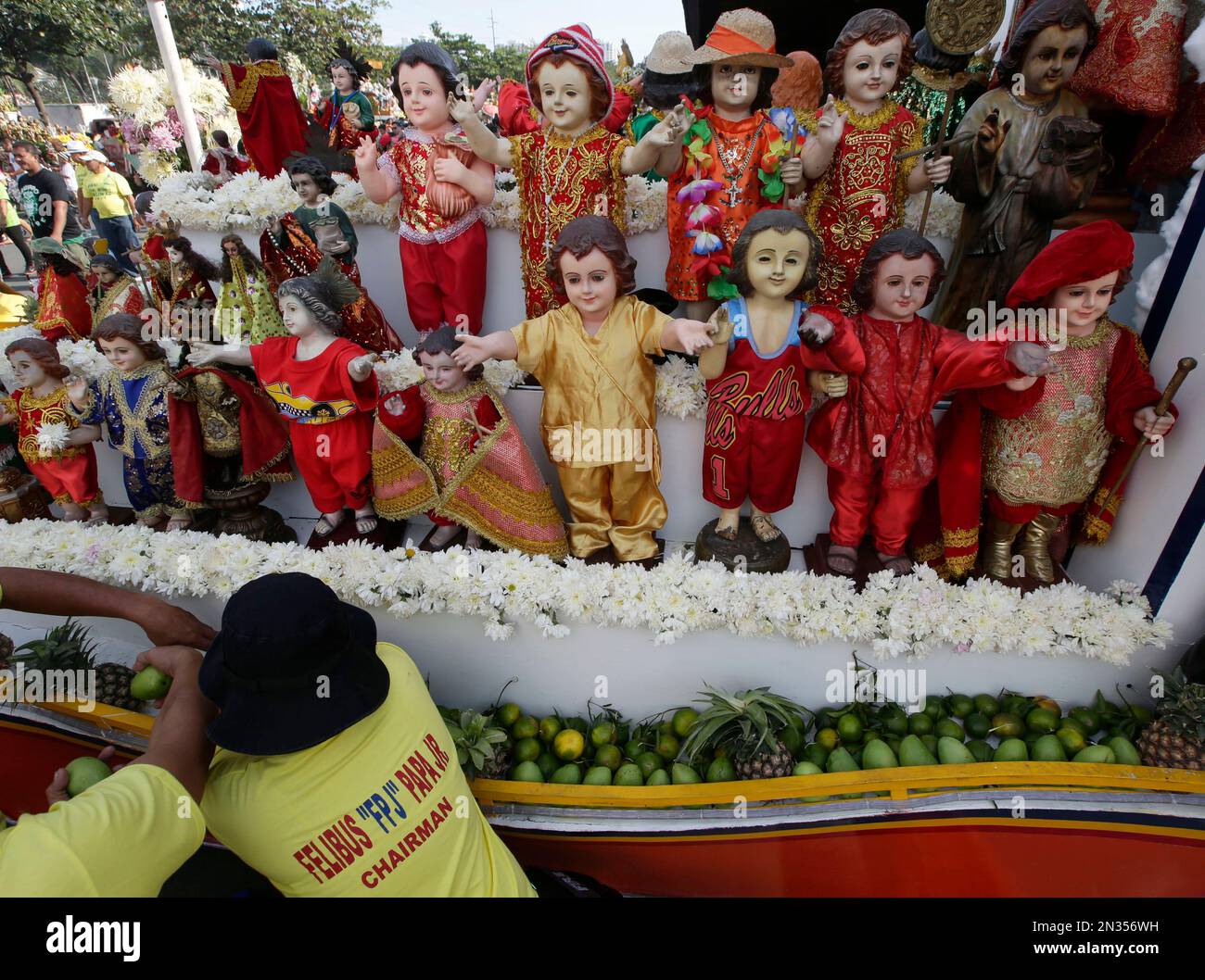 Devotees decorate their float of images of the Child Jesus also known ...