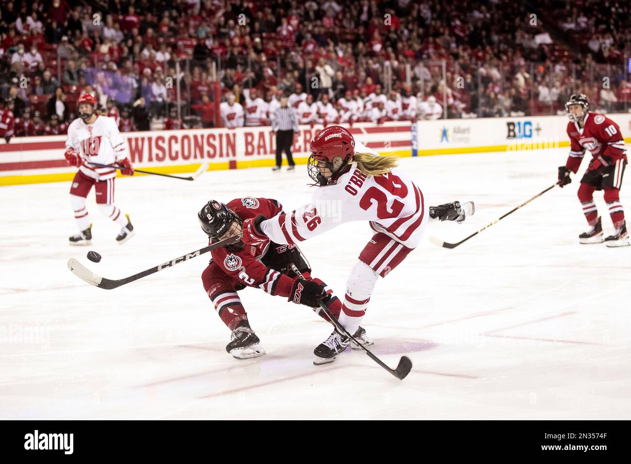 Wisconsin forward Casey O'Brien (26) shoots the puck against St. Cloud ...