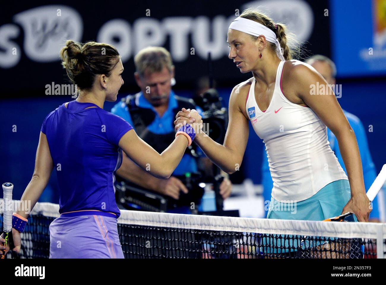 Simona Halep of Romania, left, shakes hands with Yanina Wickmayer of ...