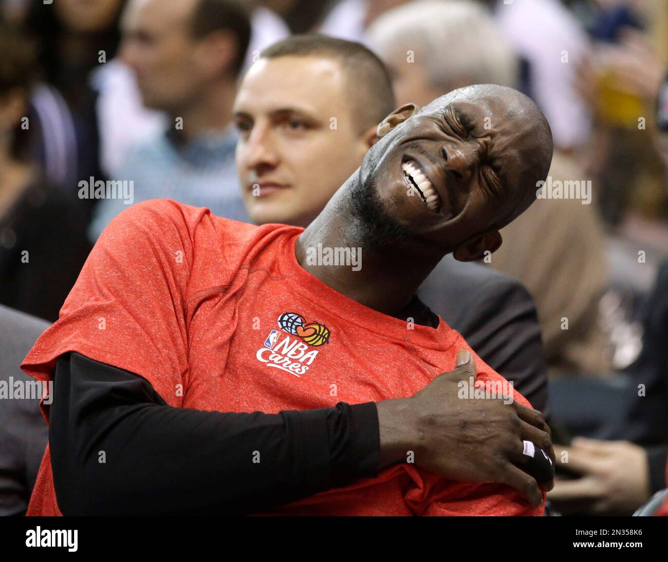 Brooklyn Nets forward Kevin Garnett (2) grimaces as he holds his ...