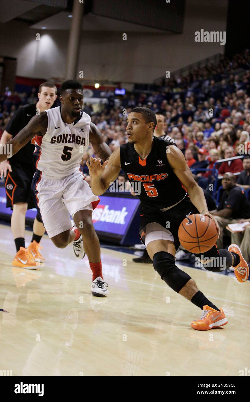 Pacific's Dulani Robinson, right, drives against Gonzaga's Gary Bell Jr ...