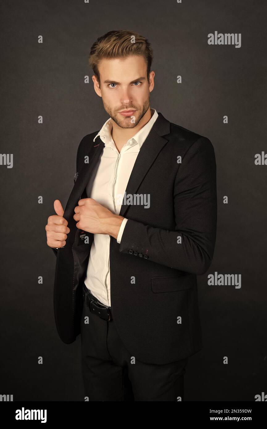 Professional man taking pocket check in formal suit jacket dark ...