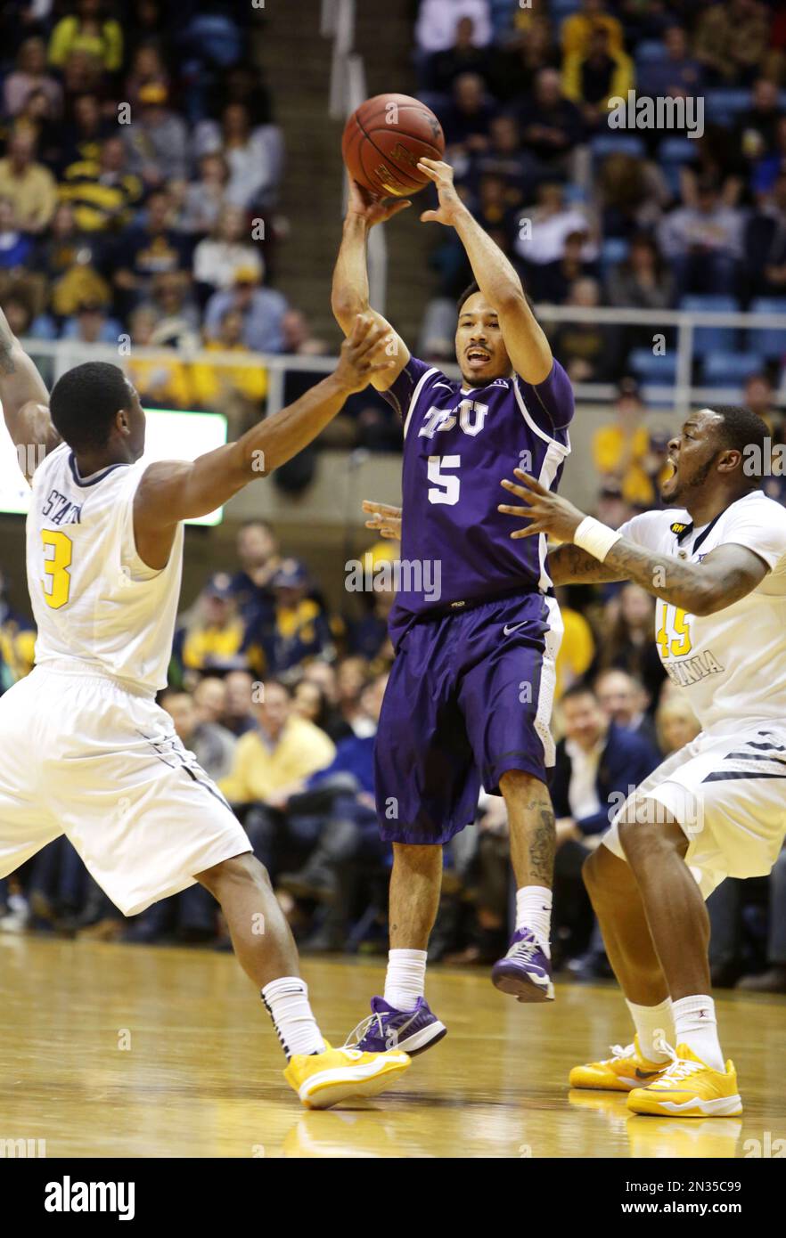 West Virginia guard Juwan Staten (3) and West Virginia forward Elijah ...