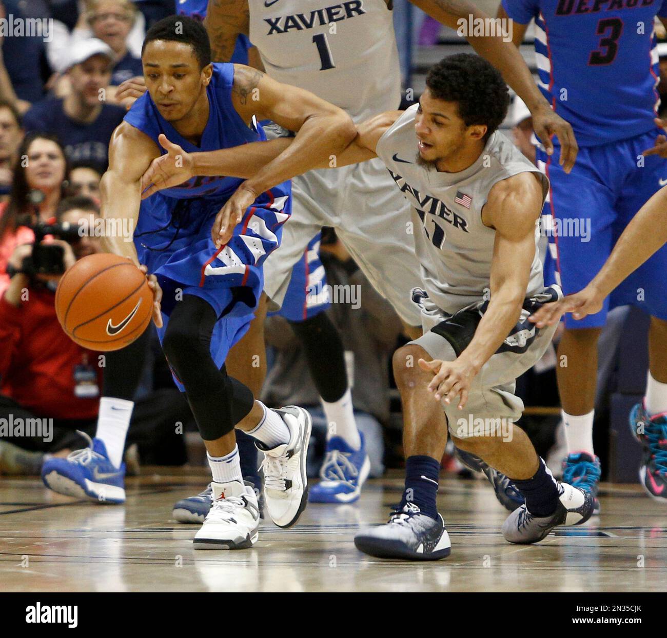 DePaul guard Darrick Wood, left, steals the ball against Xavier guard ...