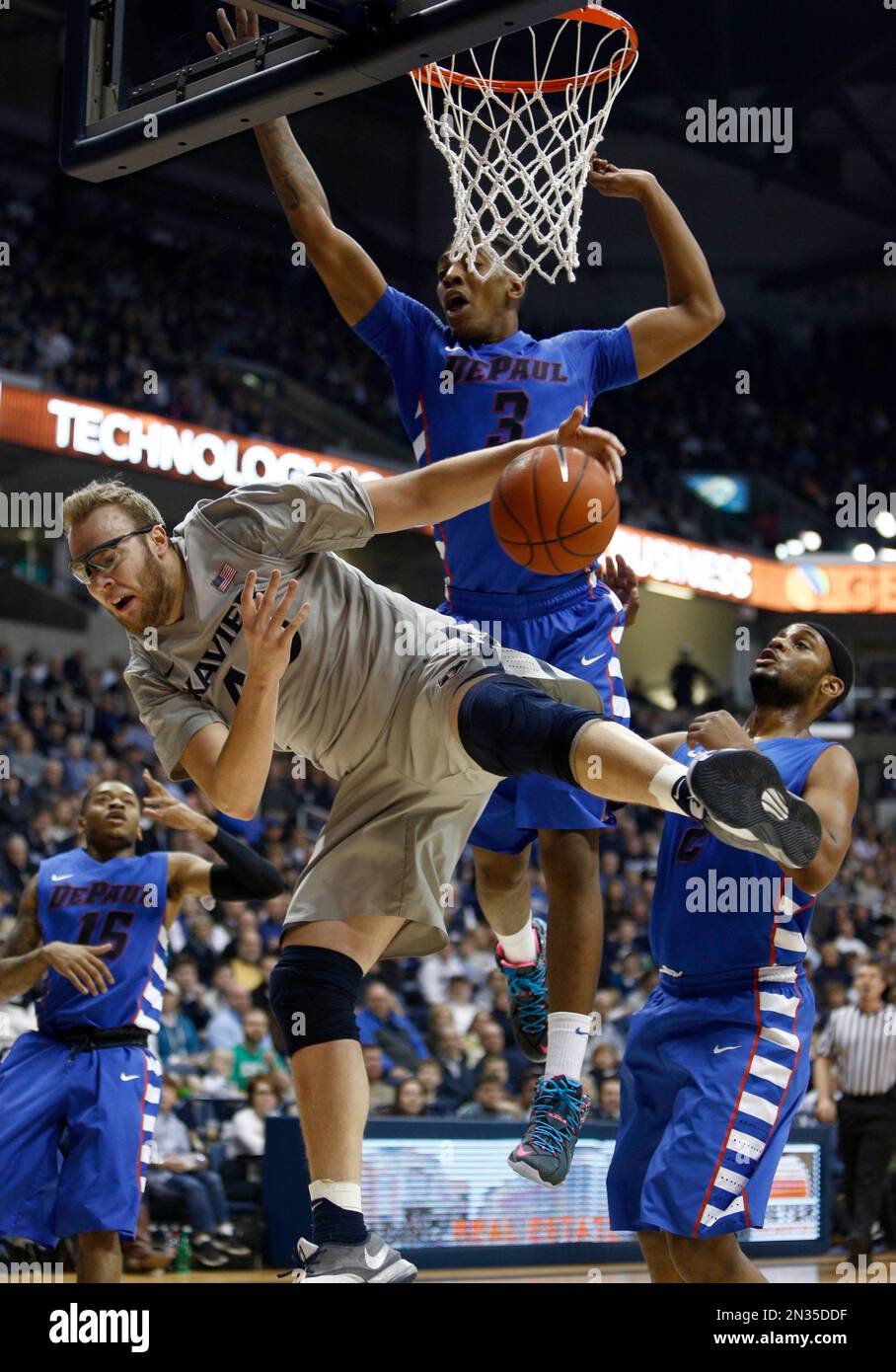 Xavier center Matt Stainbrook (40) loses control under the basket ...