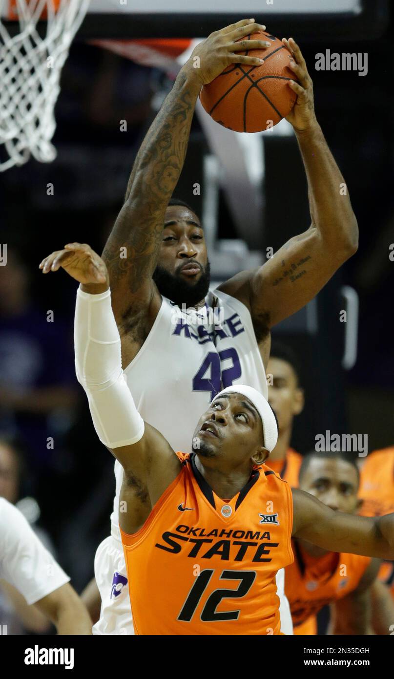 Kansas State forward Thomas Gipson (42) rebounds over Oklahoma State ...