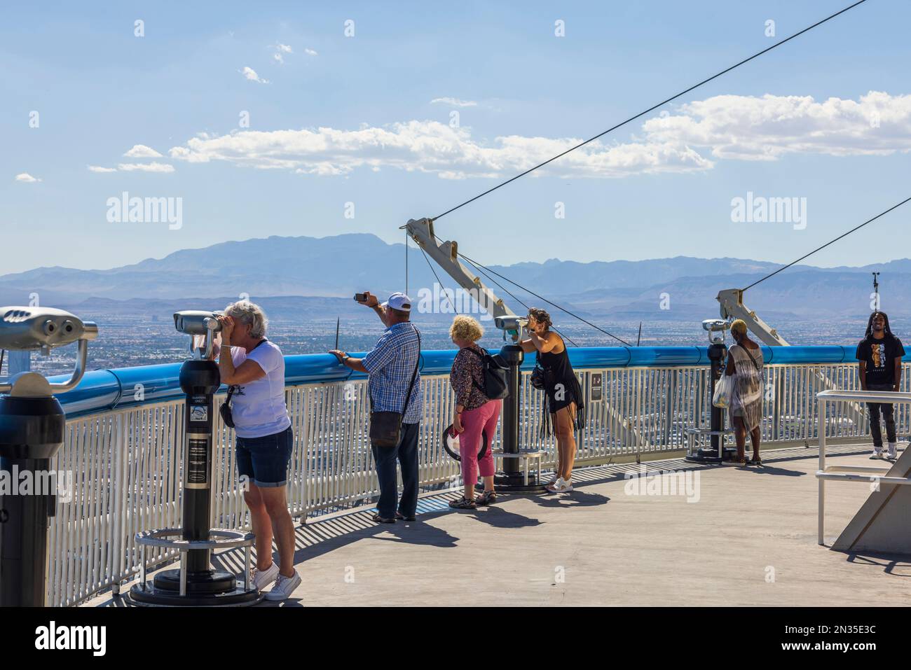 Close up view of tourists on open main observation desk of hotel Strat ...