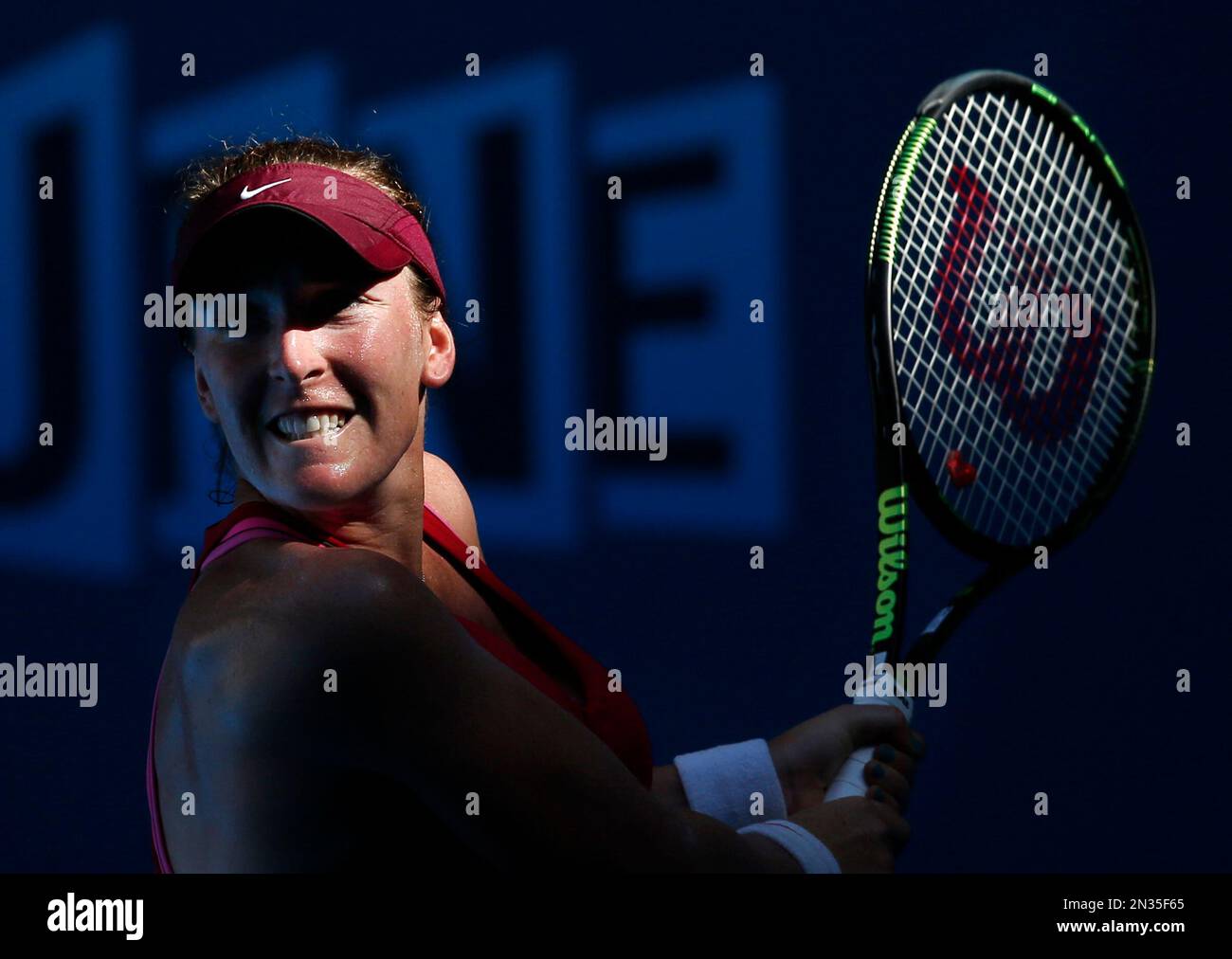 Madison Brengle of the U.S. makes a backhand return to her compatriot ...