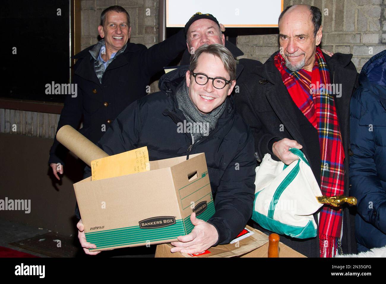 Matthew Broderick, center, and F. Murray Abraham, right, helps move to ...