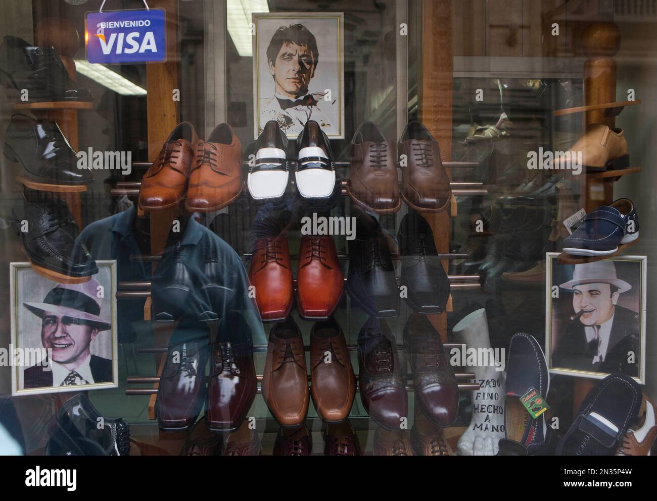 A men's shoe store features portraits of Latin American tango icon ...