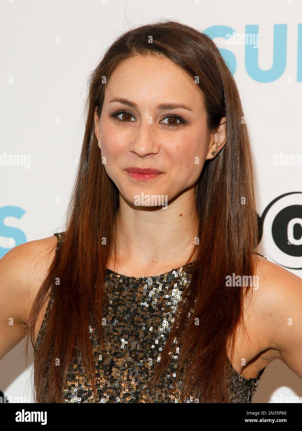Troian Bellisario arrives at "Behind The Lens: An Intimate Look At The World Of Suits" at the ...