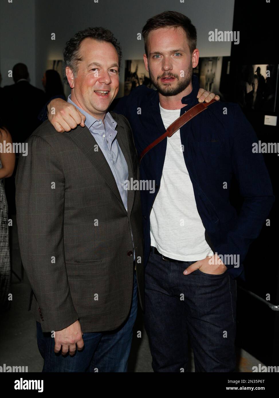 David Costabile, left, and Patrick J. Adams, right, arrive at "Behind ...