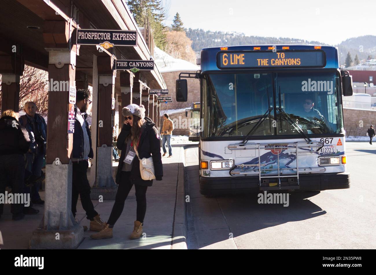 People are seen waiting for their bus at the Park City bus terminal on ...