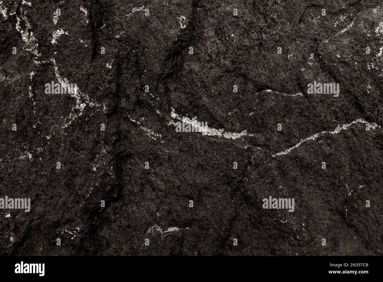 Texture of natural stone with irregularities. Background from a black ...