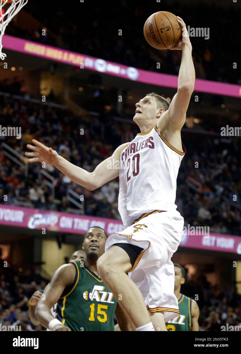 Cleveland Cavaliers' Timofey Mozgov, from Russia, goes up to dunk ...