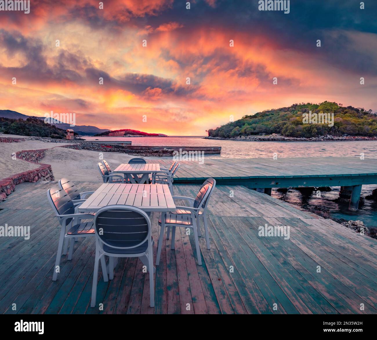 Dramatic spring sunset in Ksamil town. Incredible evening seascape if ...
