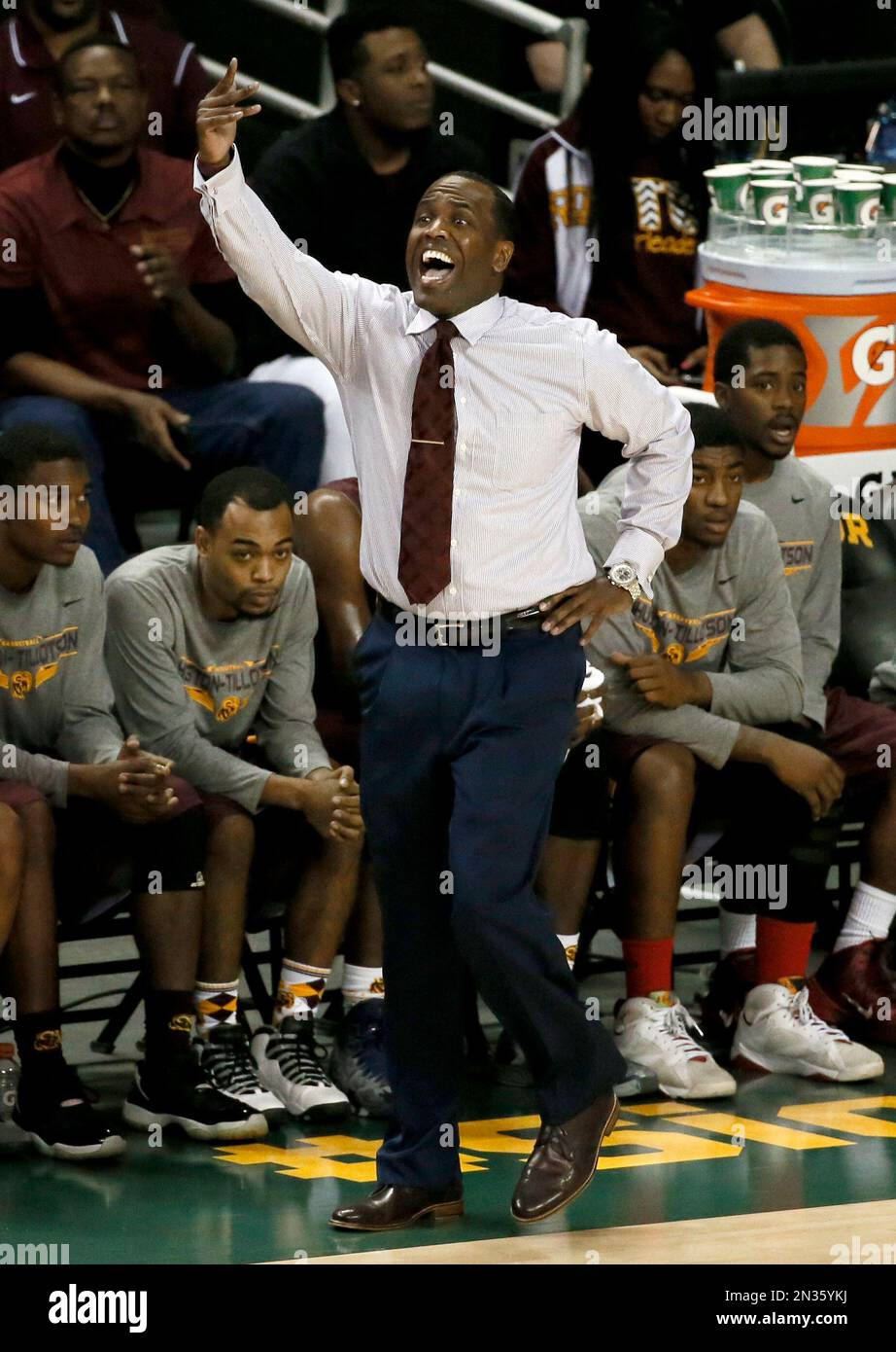 Huston-Tillotson head coach Thomas Henderson instructs his team against ...