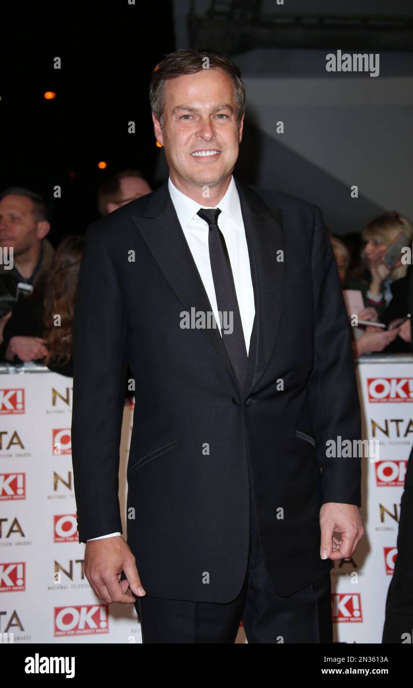 Peter Jones poses for photographers upon arrival at the National ...