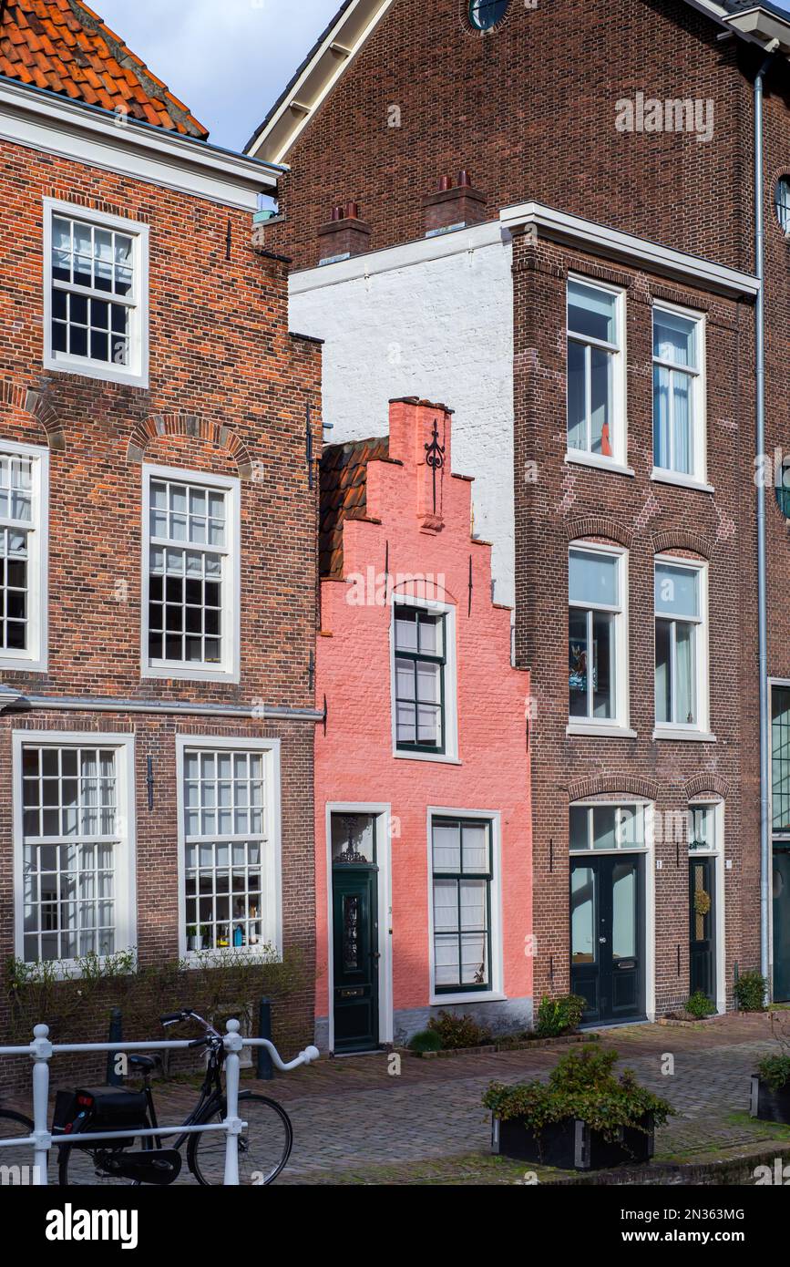 Pink house on Dutch Canal in Leiden, Holland Stock Photo - Alamy