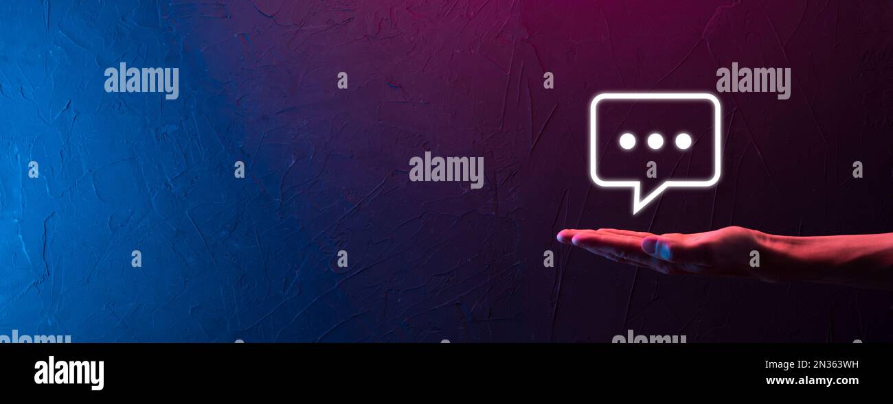 Hand on neon background holding a message icon, bubble talk ...