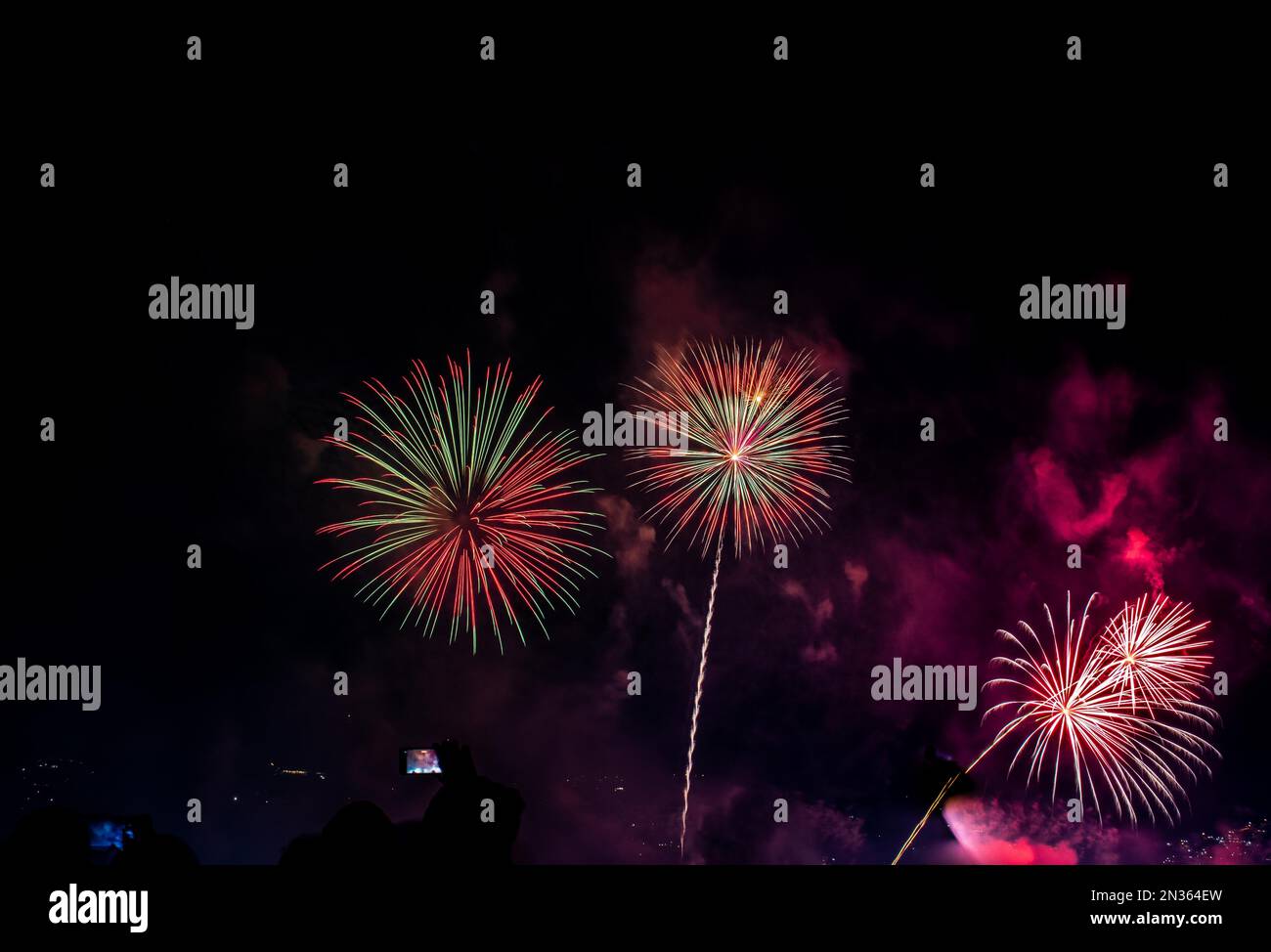 The display of bright colorful fireworks against the black sky ...