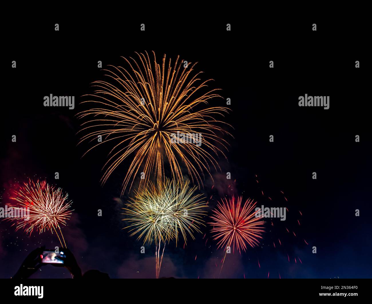The display of bright colorful fireworks against the black sky ...