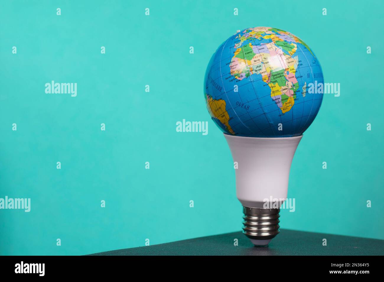 Light bulb with Earth planet model with space for text. Global ecology ...