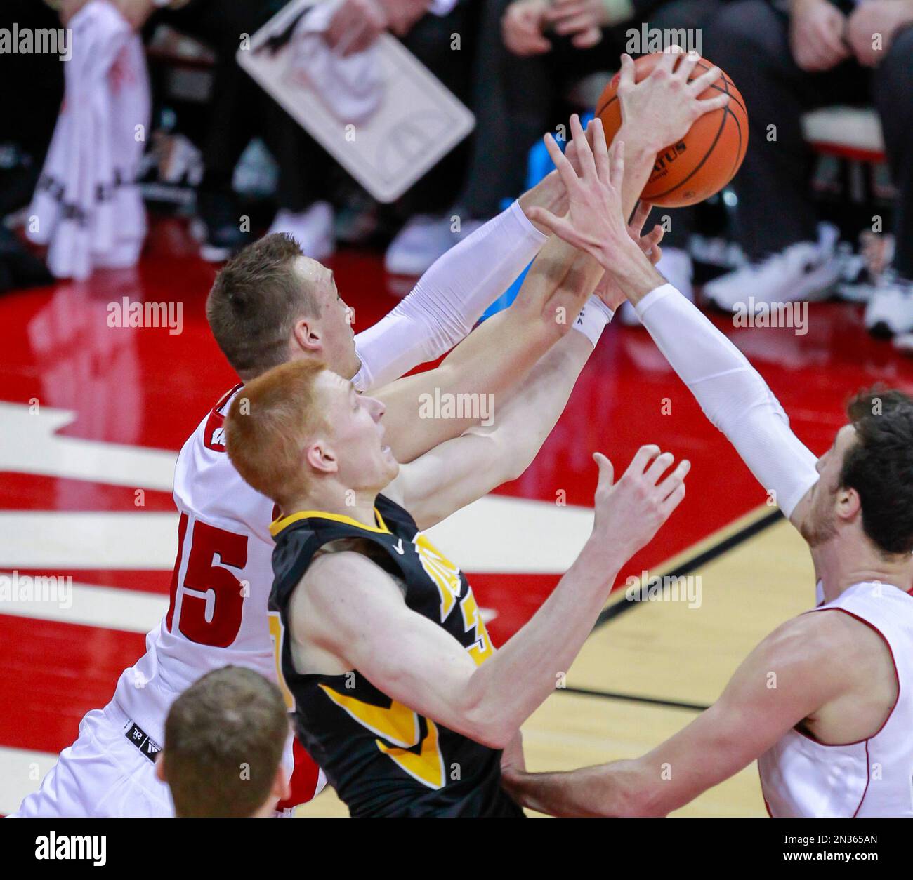 Wisconsin's Sam Dekker (15) gets an offensive rebound away from Iowa's ...