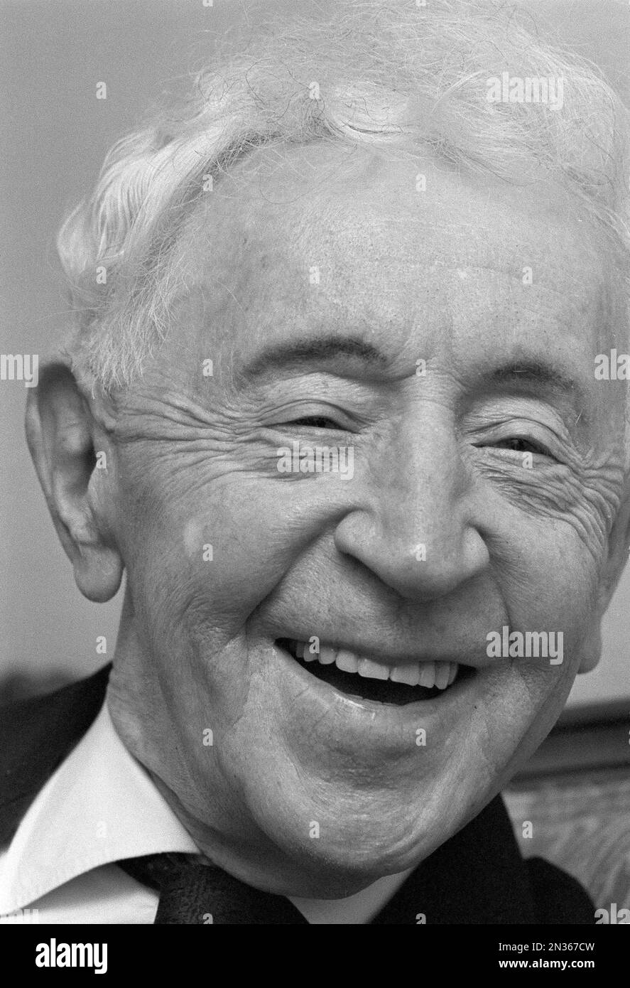 Noted pianist-composer Arthur Rubinstein gives a wide smile as he marks ...