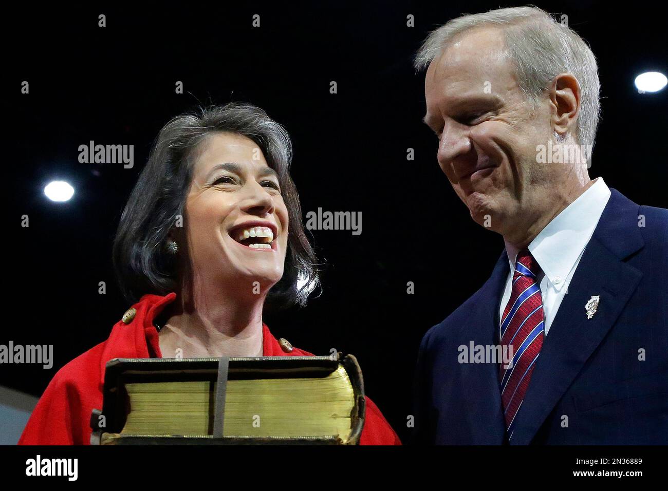 In this Monday, Jan. 12, 2015 photo, Bruce Rauner takes the oath of ...