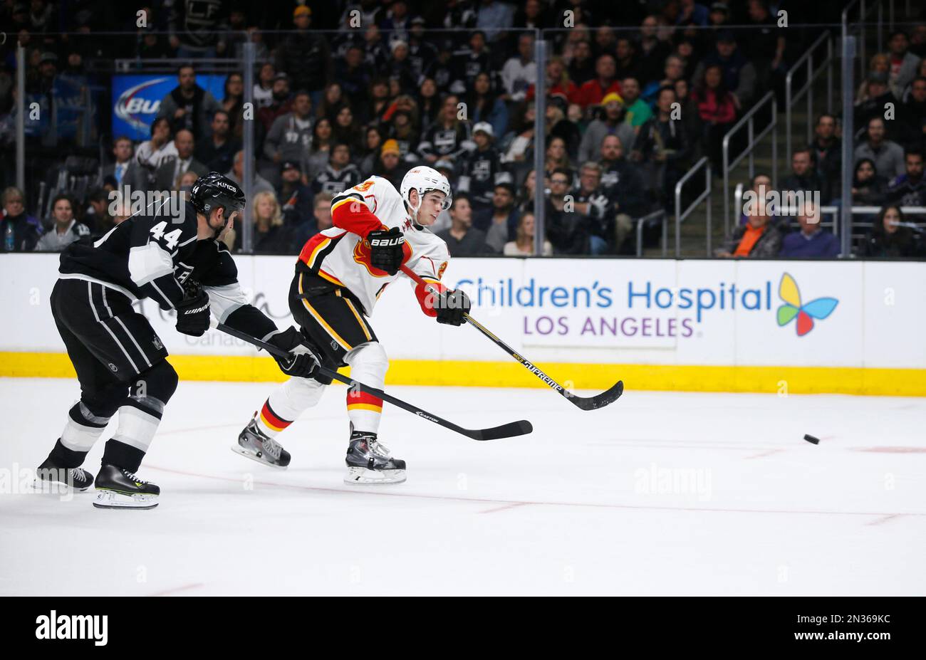 Calgary Flames center Sean Monahan shoots and scores while Los Angeles ...