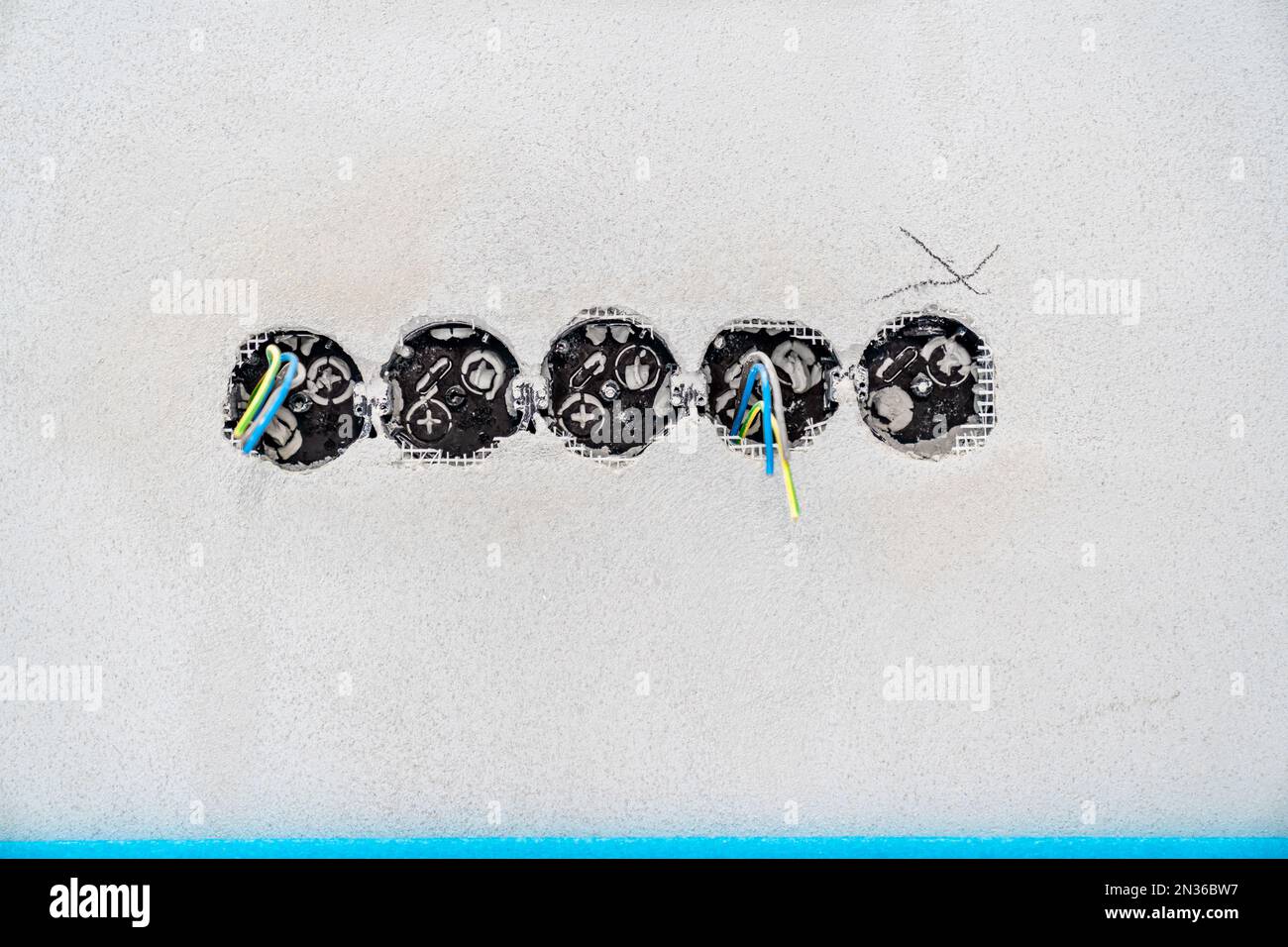 holes and wires in the wall for sockets and switches Stock Photo - Alamy