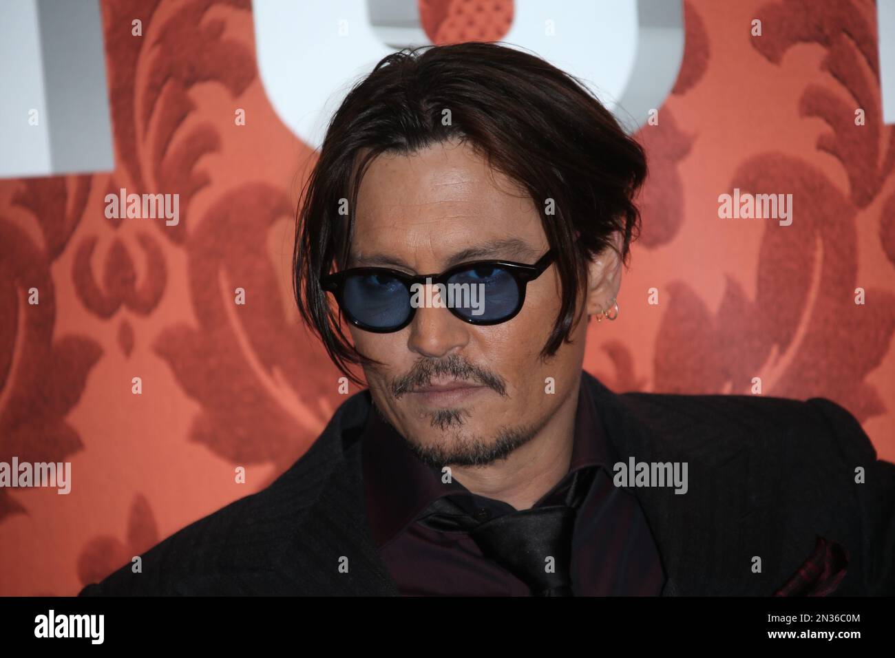 Actor Johnny Depp poses for photographers upon arrival at the premiere ...
