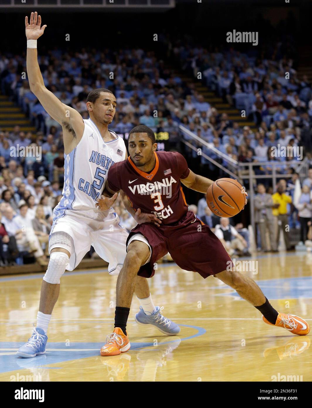 North Carolina's Marcus Paige (5) guards Virginia Tech's Adam Smith (3 ...