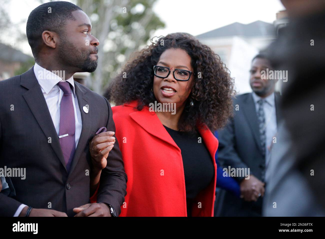 Oprah Winfrey locks arms with David Oyelowo, who portrays Martin Luther ...
