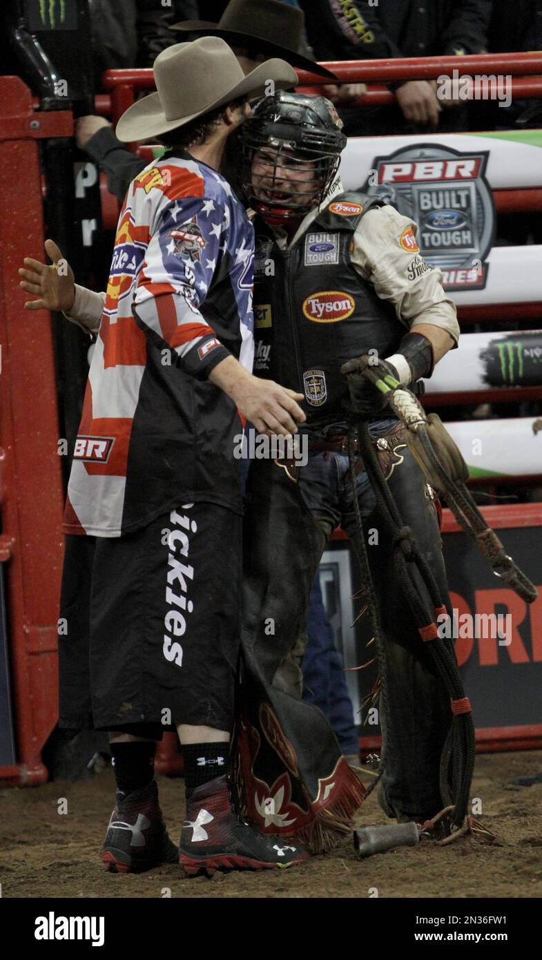 Chase Outlaw, right, of Hamburg, Ariz., reacts after riding Crack The ...