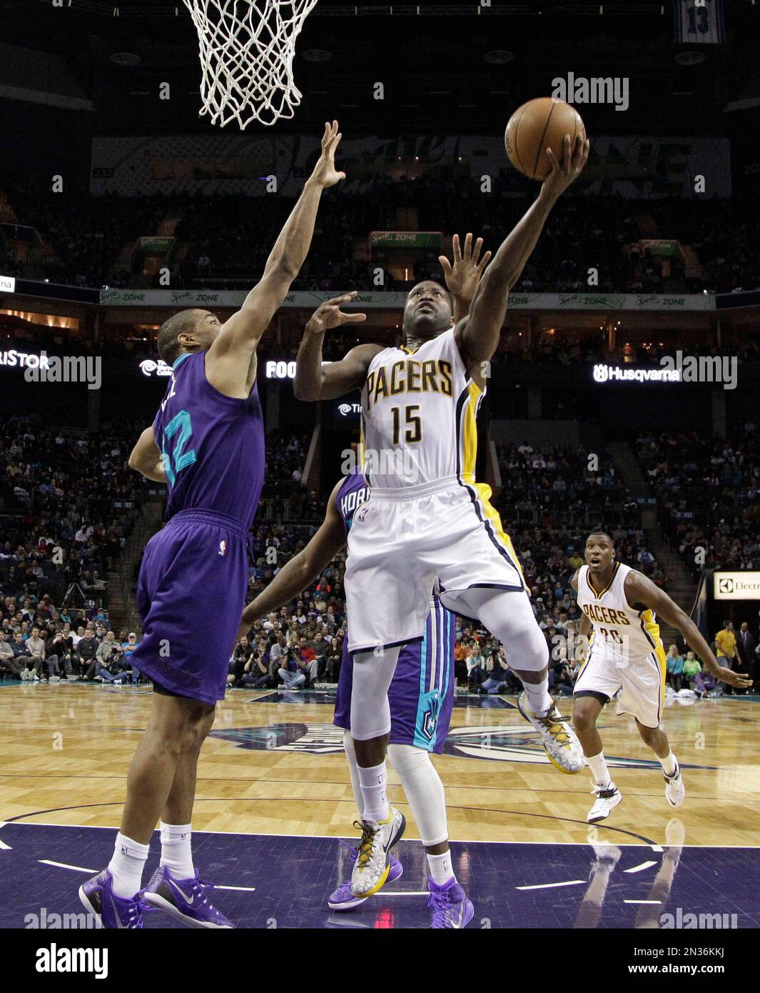 Indiana Pacers' Donald Sloan (15) shoots over Charlotte Hornets' Gary ...