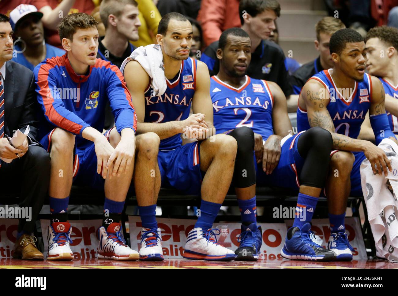 Kansas forward Perry Ellis, second from left, sits on the bench during ...