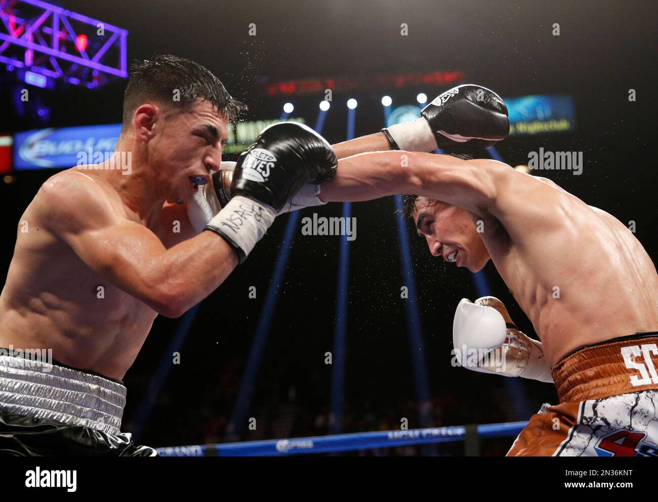 Leo Santa Cruz, right, hits Jesus Ruiz during their WBC super ...