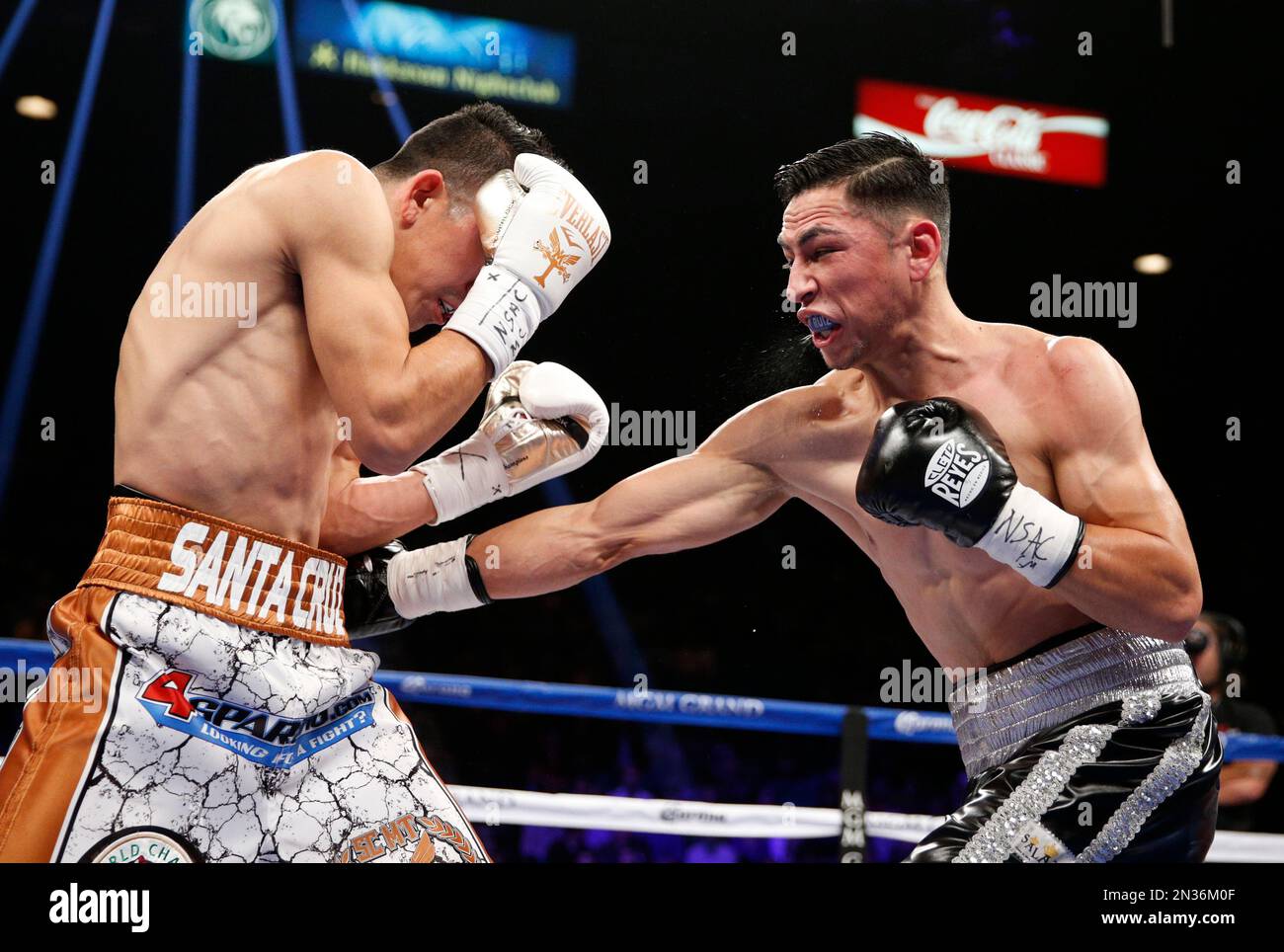 Jesus Ruiz hits Leo Santa Cruz during their WBC super bantamweight ...