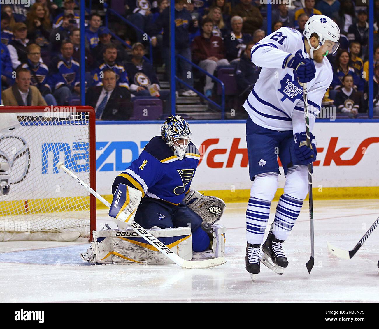 St. Louis Blues goalie Brian Elliott makes a save on a shot deflected ...